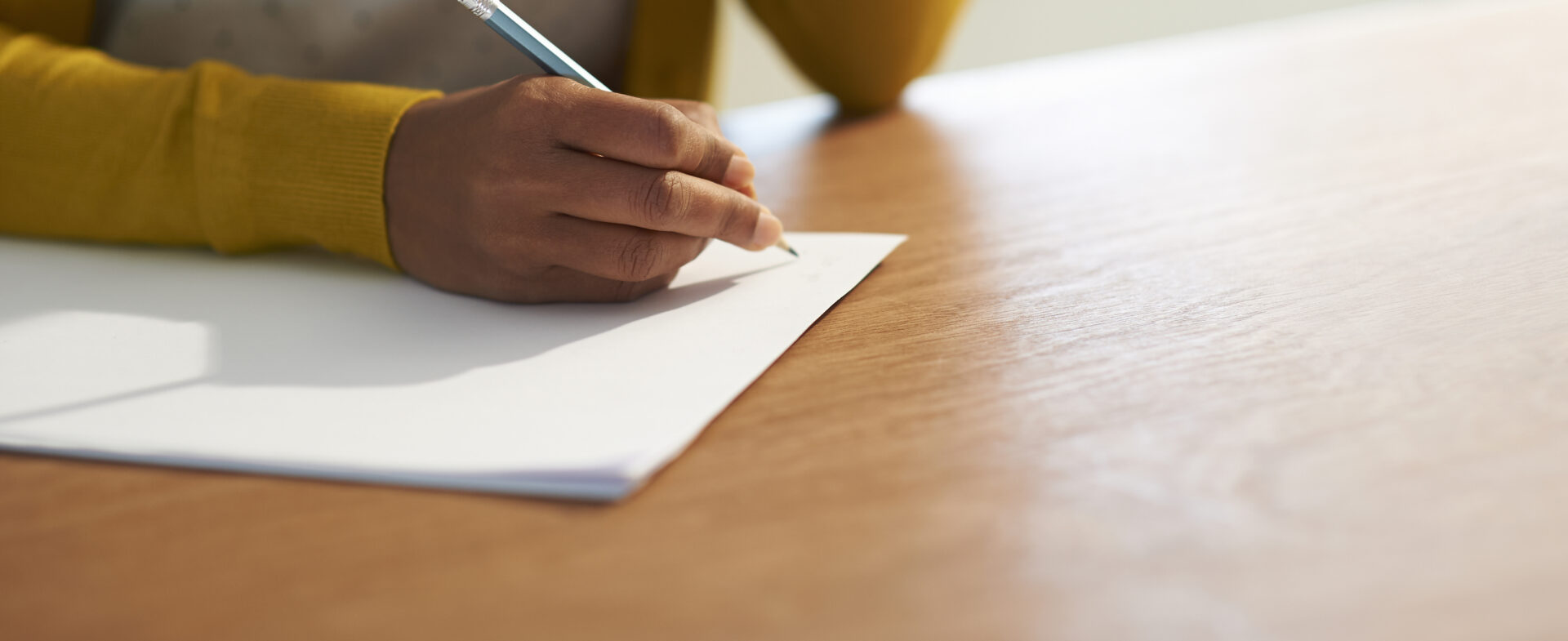 Woman making notes with pencil and paper close up. - World of Better ...
